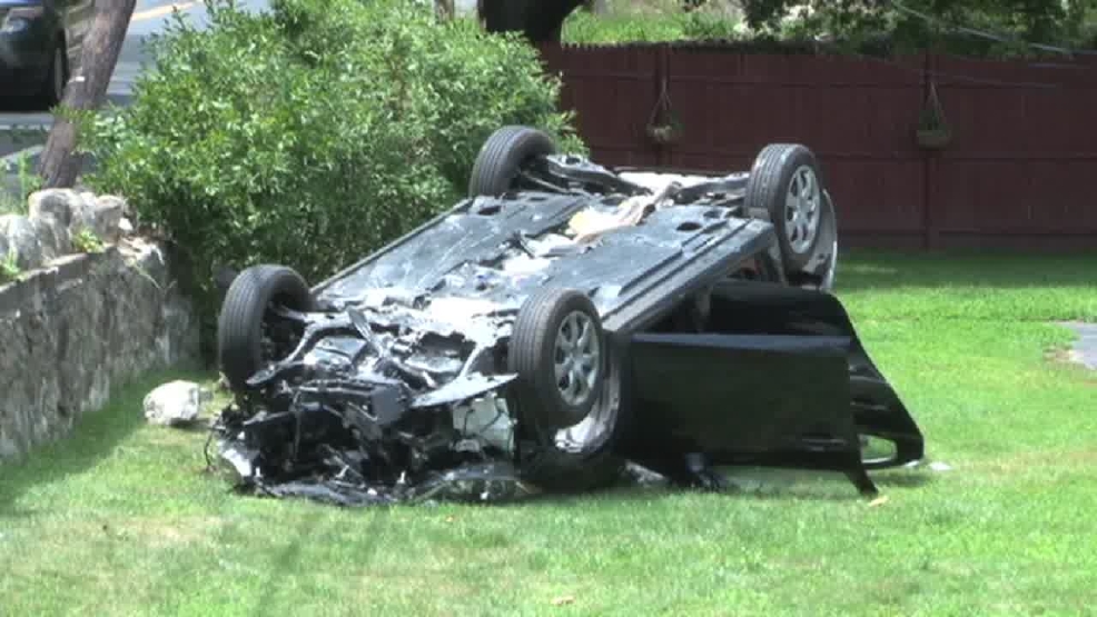Car rolls over stone wall | WJAR
