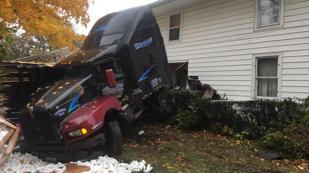 Semi-trailer splits in half after striking tree, semi continues forward ...